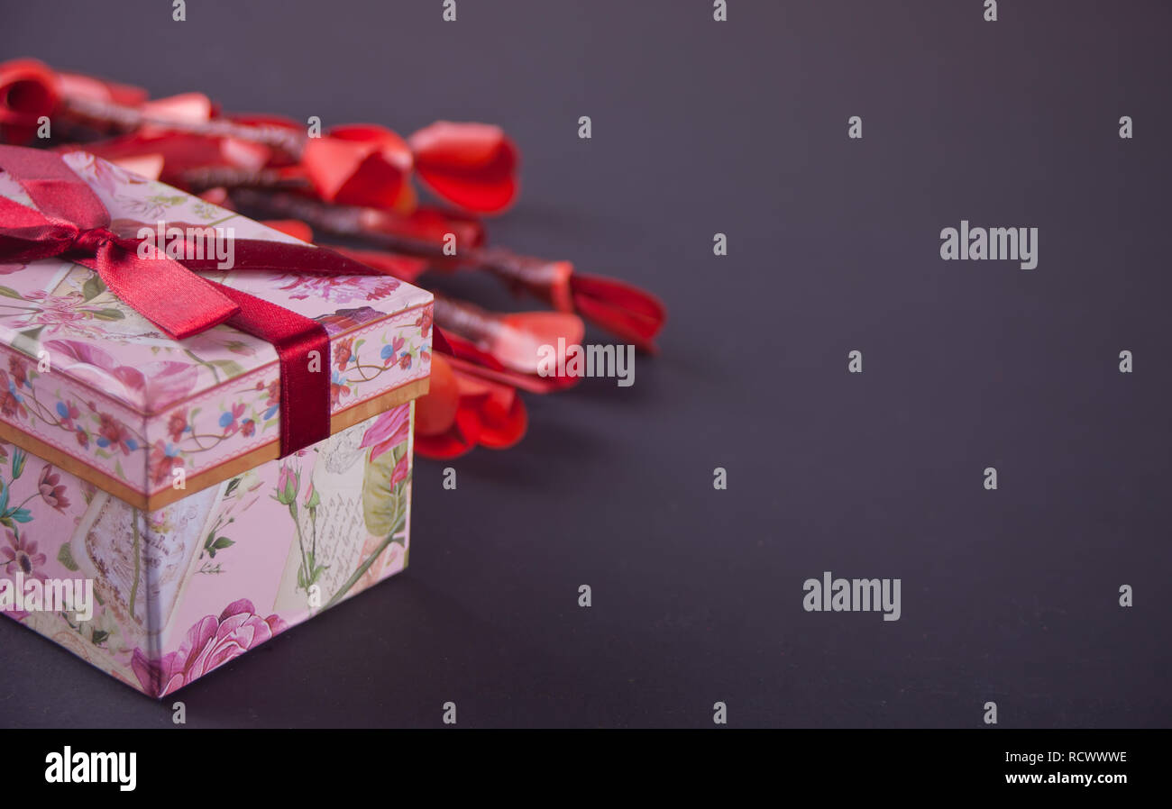 Valentines day concept with paper flowers and gift box Stock Photo - Alamy