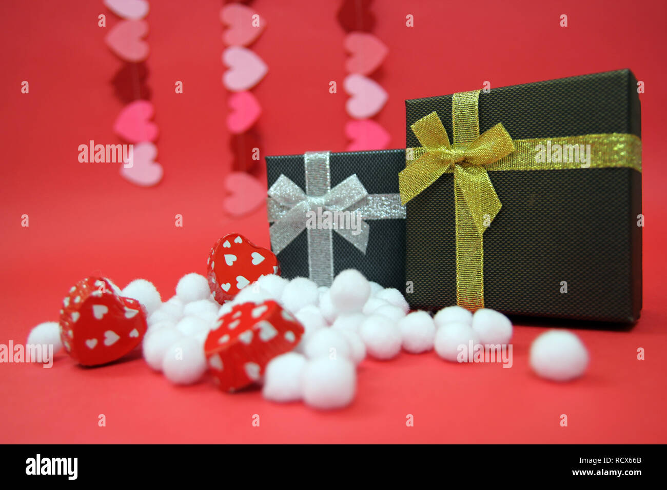 Gift box with red theme Stock Photo - Alamy