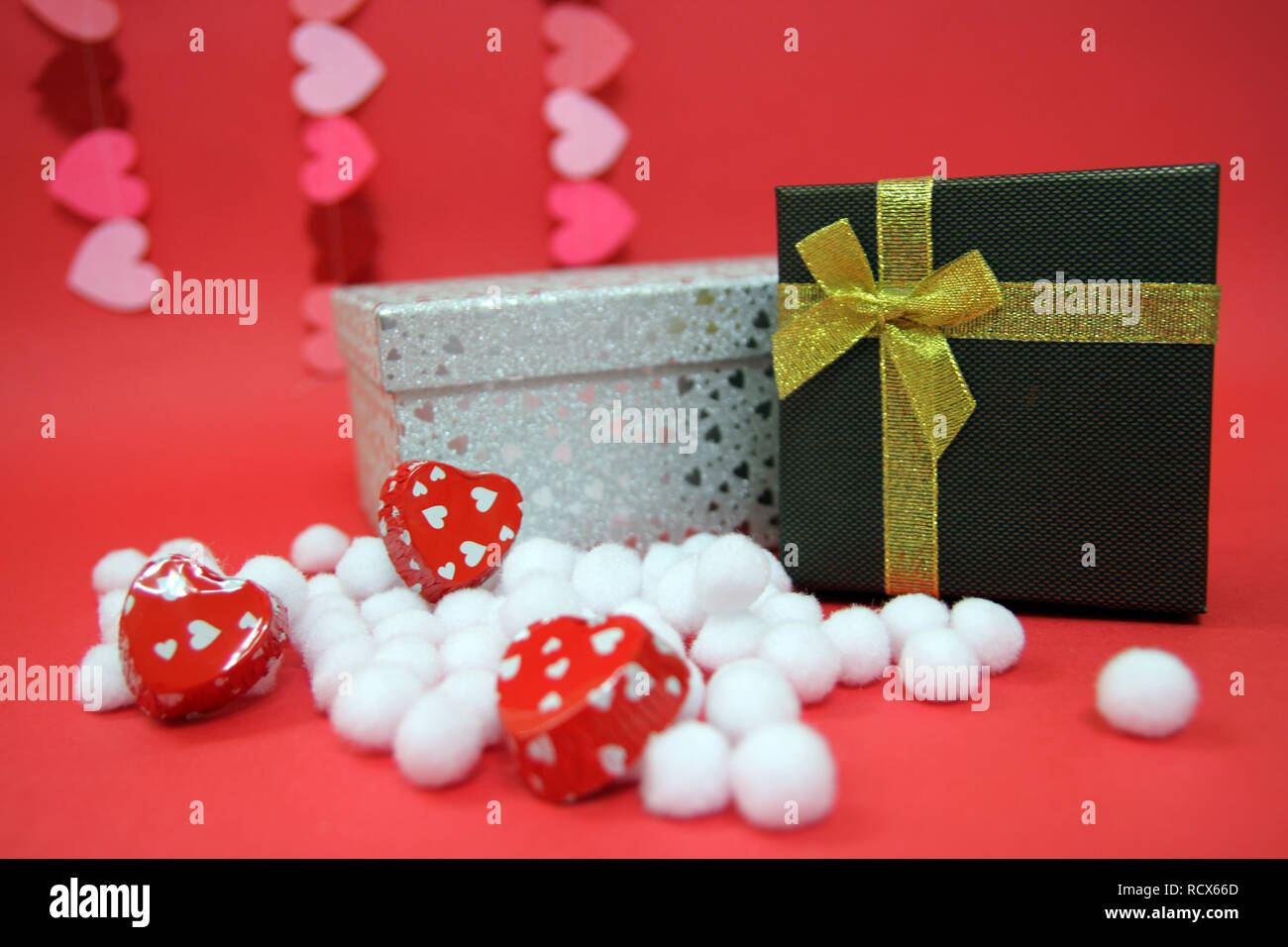 Gift box with red theme Stock Photo - Alamy