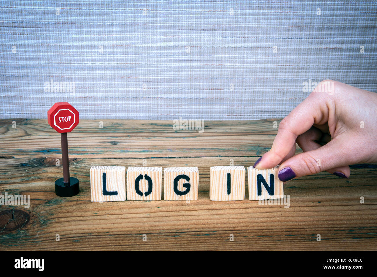 Stop log in concept. Wooden letters on the office desk Stock Photo - Alamy