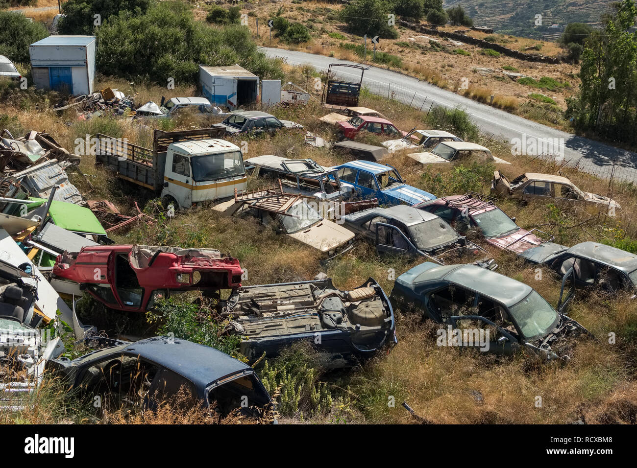 Old rusty corroded cars in car scrapyard Stock Photo - Alamy