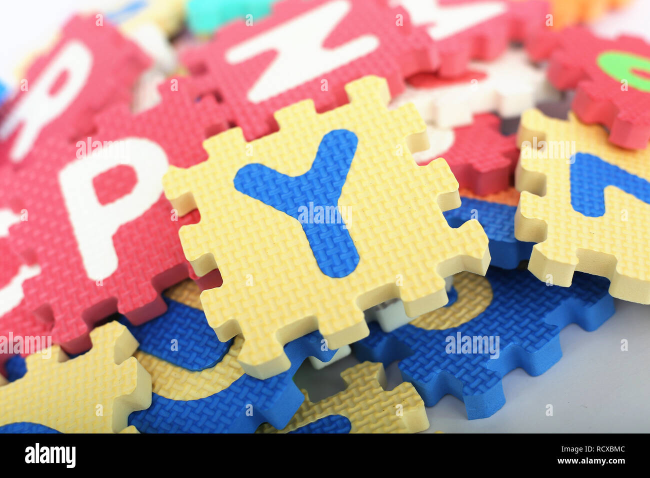 Pile of colorful alphabets blocks. Isolated on the white background ...