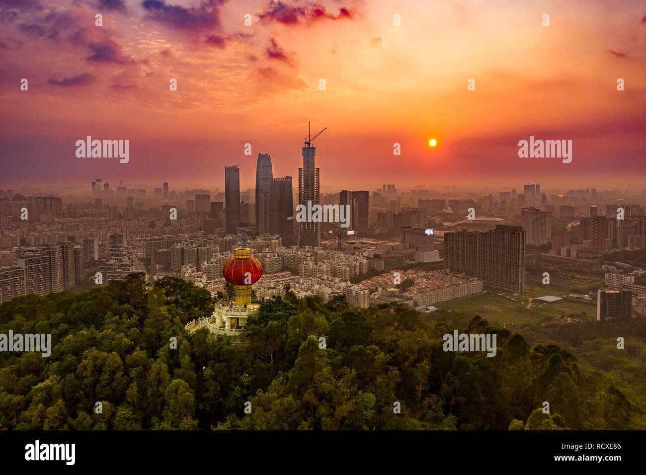Drone Sunset panorama with buildings on the back and clouds Stock Photo ...