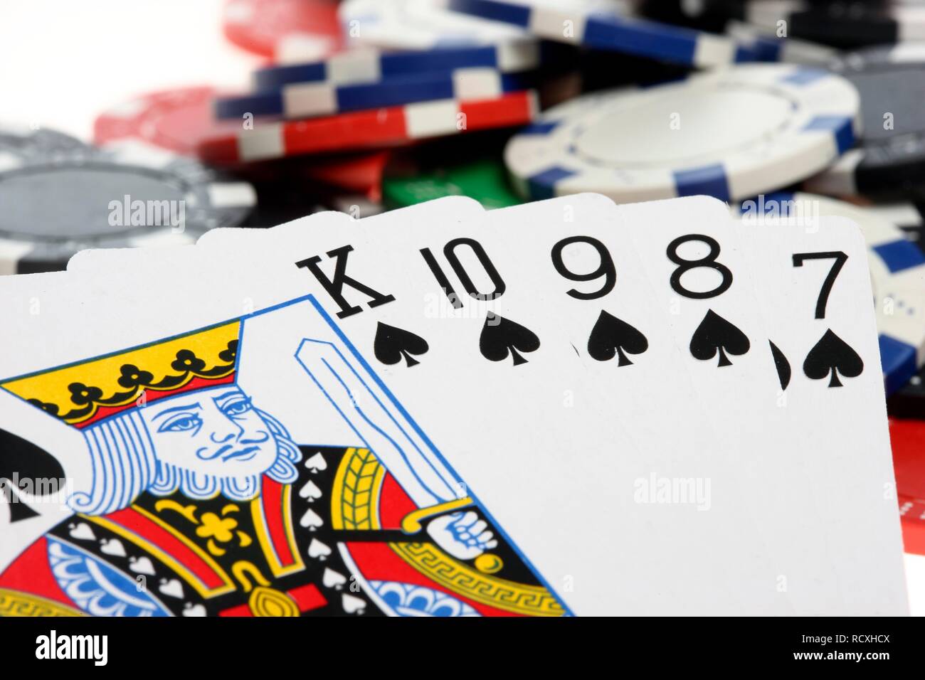 Poker, playing cards, gaming chips, tokens, with different values ...