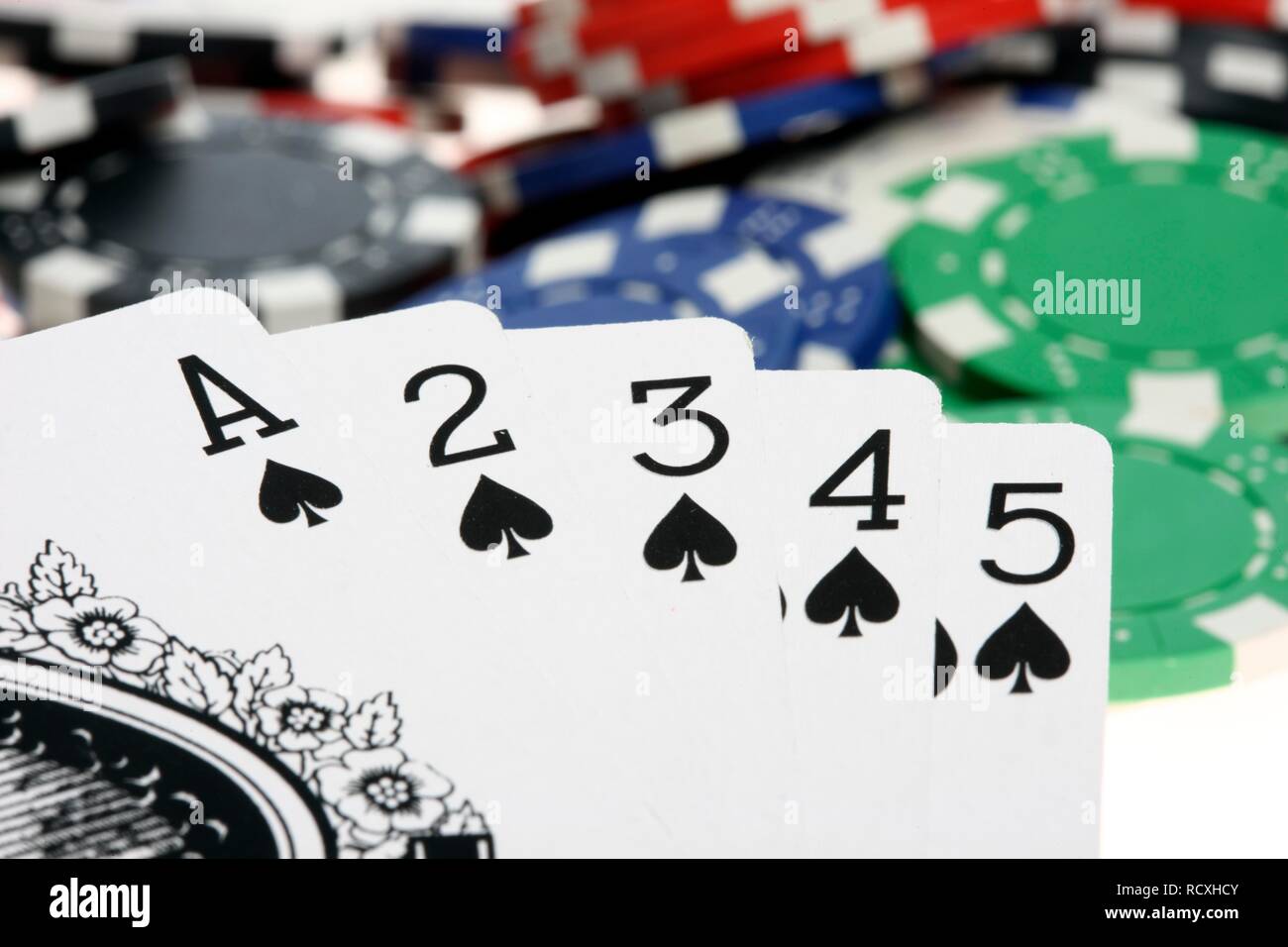 Poker, playing cards, gaming chips, tokens, with different values ...