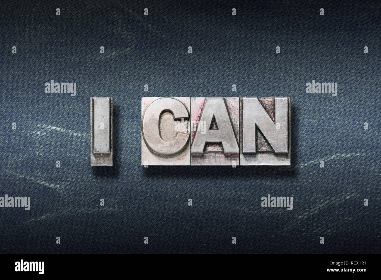 I can phrase made from metallic letterpress on dark jeans background ...