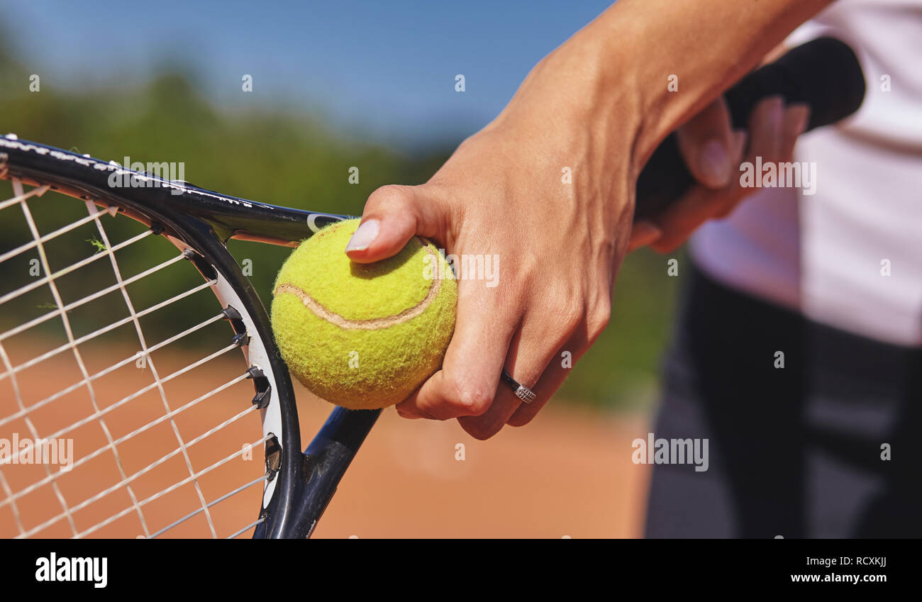 Woman with a tennis racket hi-res stock photography and images - Alamy