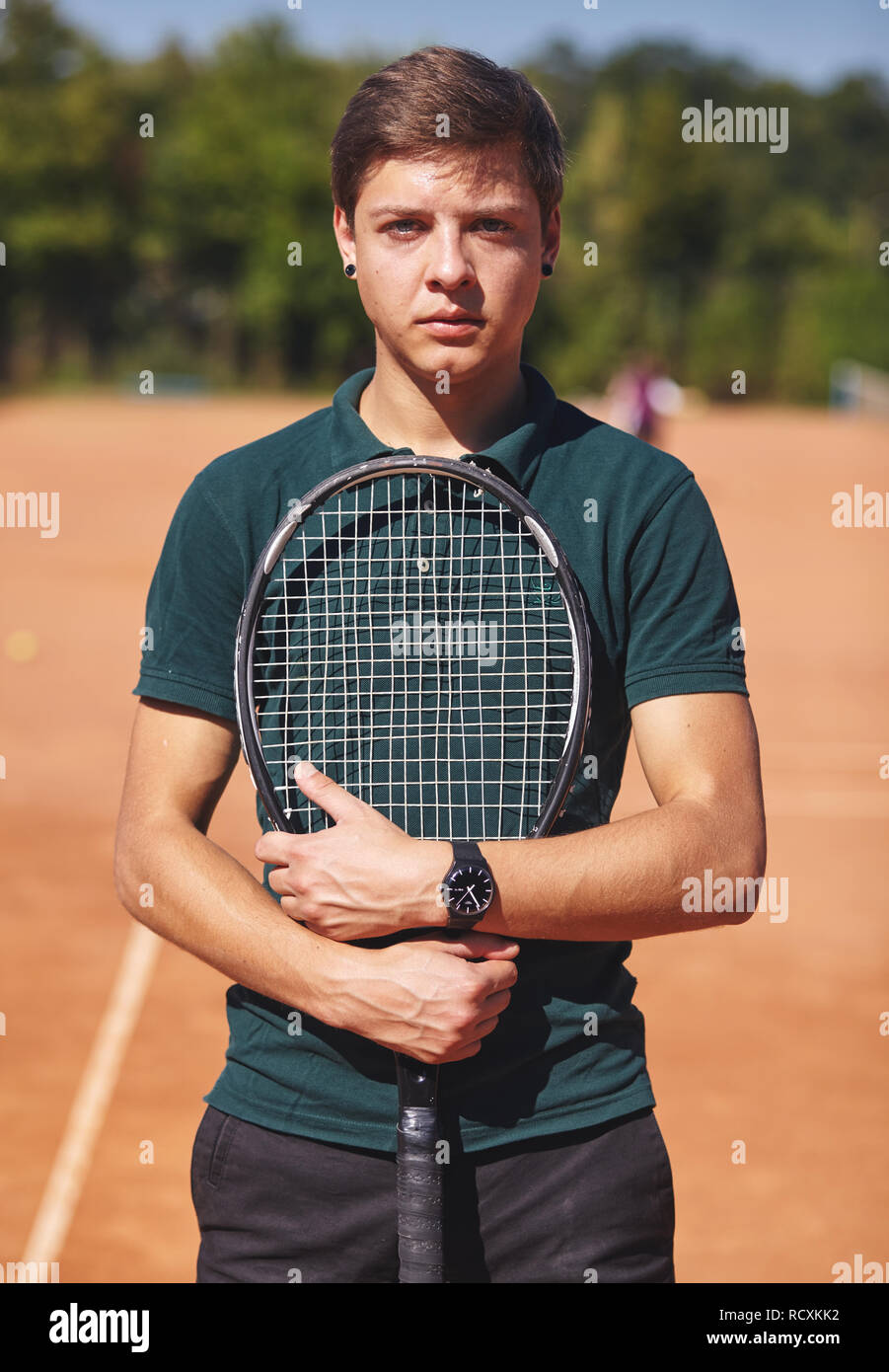 a Tennis player holding racket and in hands Stock Photo - Alamy