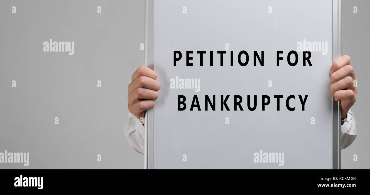 men's hands holding a poster with the inscription petition for ...