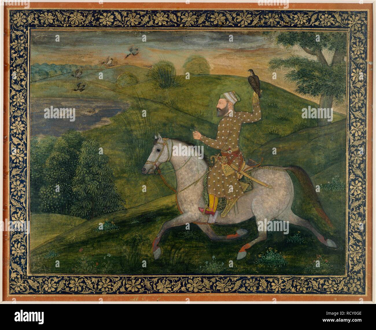 A Mughal nobleman out hawking. The nobleman, wearing a floral brown ...
