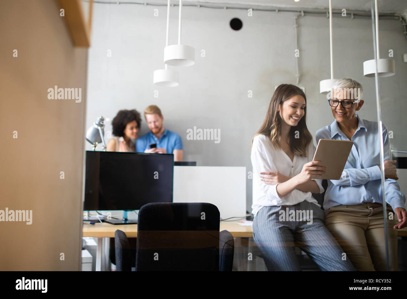 Creative business people working on business project in office Stock ...