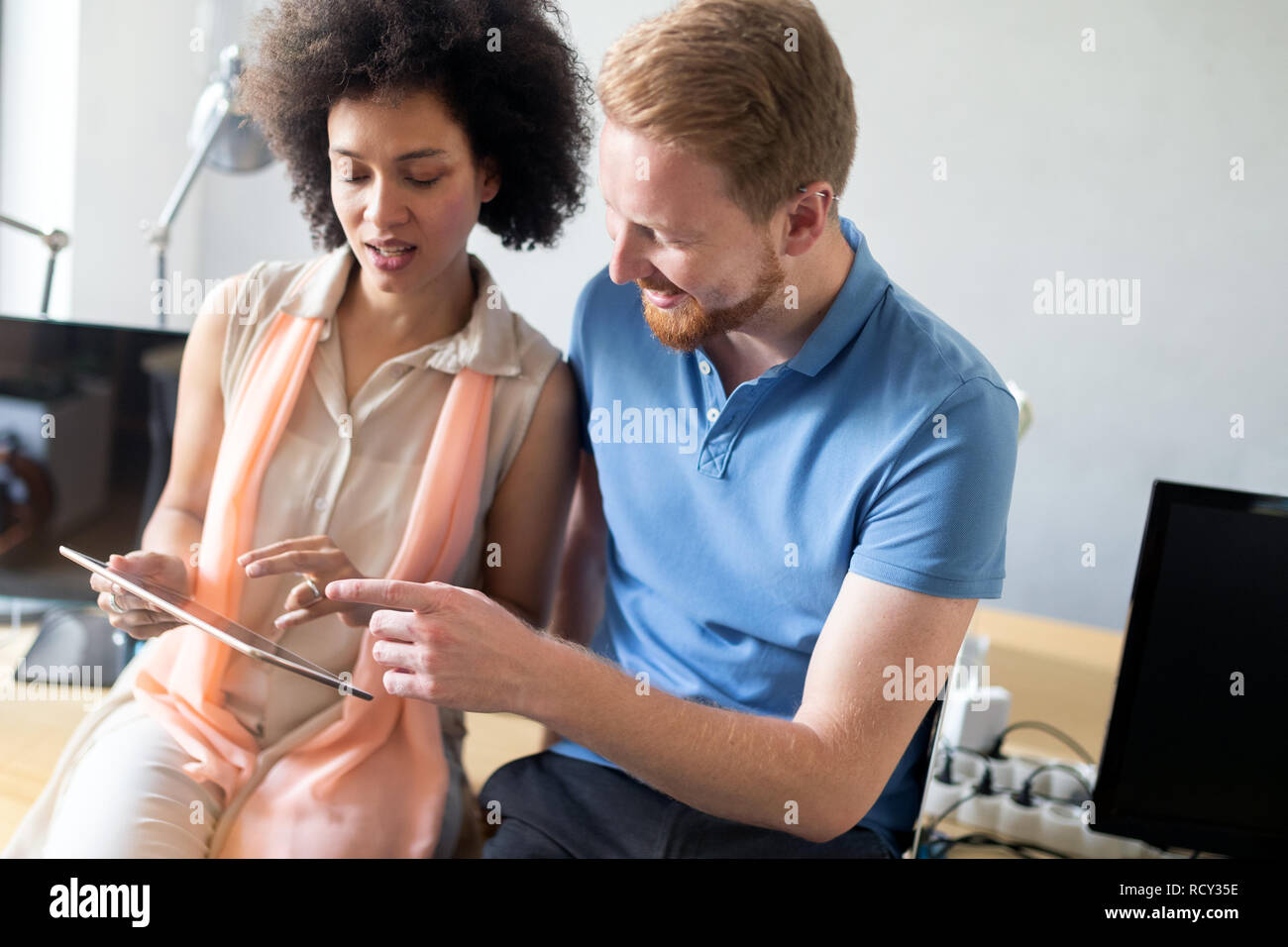 Colleagues developing software together hi-res stock photography and ...