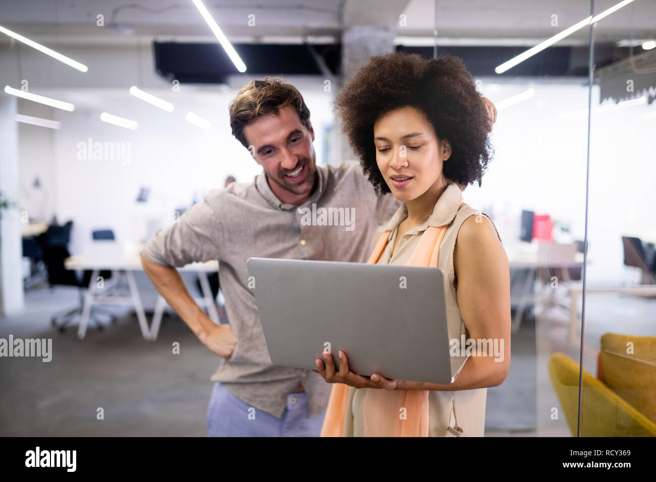 Programmers cooperating at IT company developing apps Stock Photo - Alamy