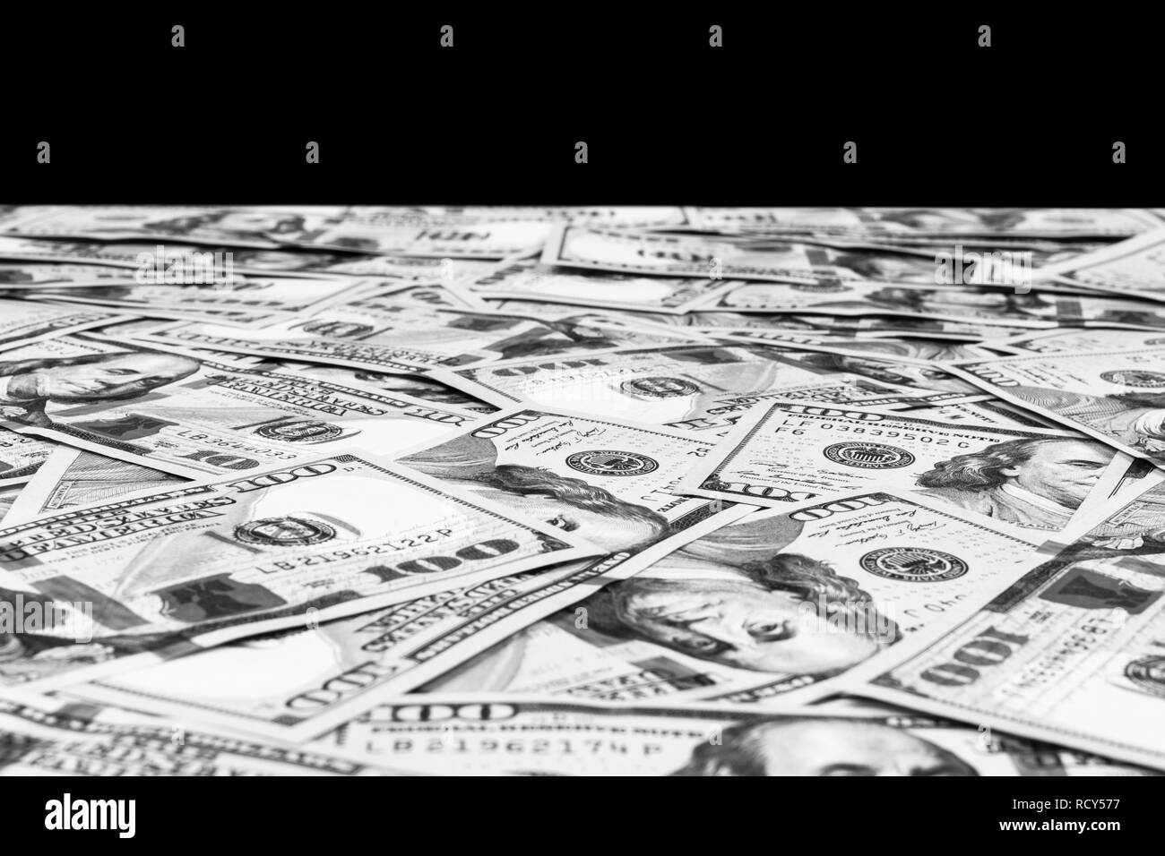 Stack of one hundred dollar bills isolated on black background. Stack ...