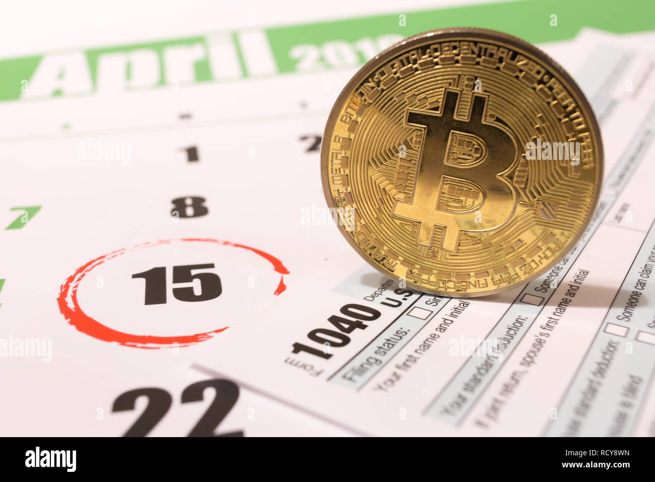 Bitcoin and 2019 calendar with 1040 income tax form for 2018 showing ...