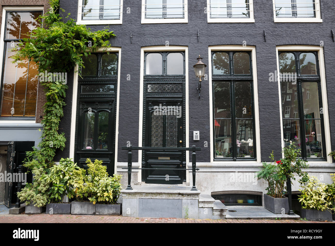Traditional old building with plants in Amsterdam, Netherlands Stock ...