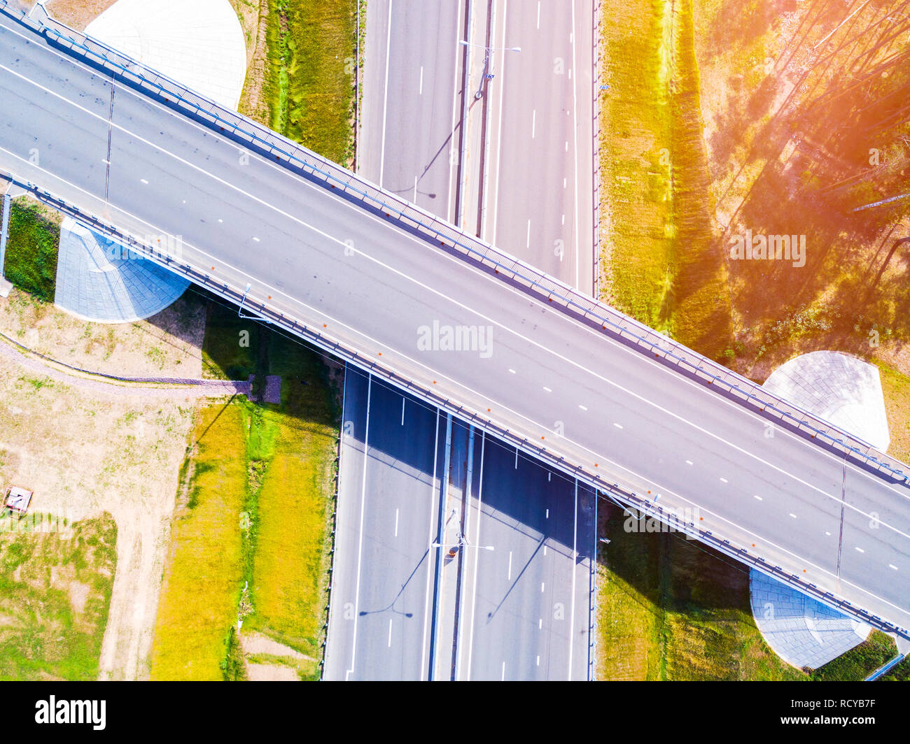 Aerial view of highway in city. Cars crossing interchange overpass ...