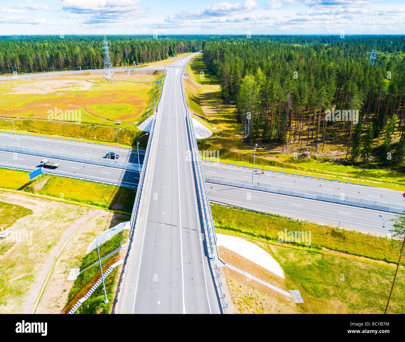 Aerial view of highway in city. Cars crossing interchange overpass ...