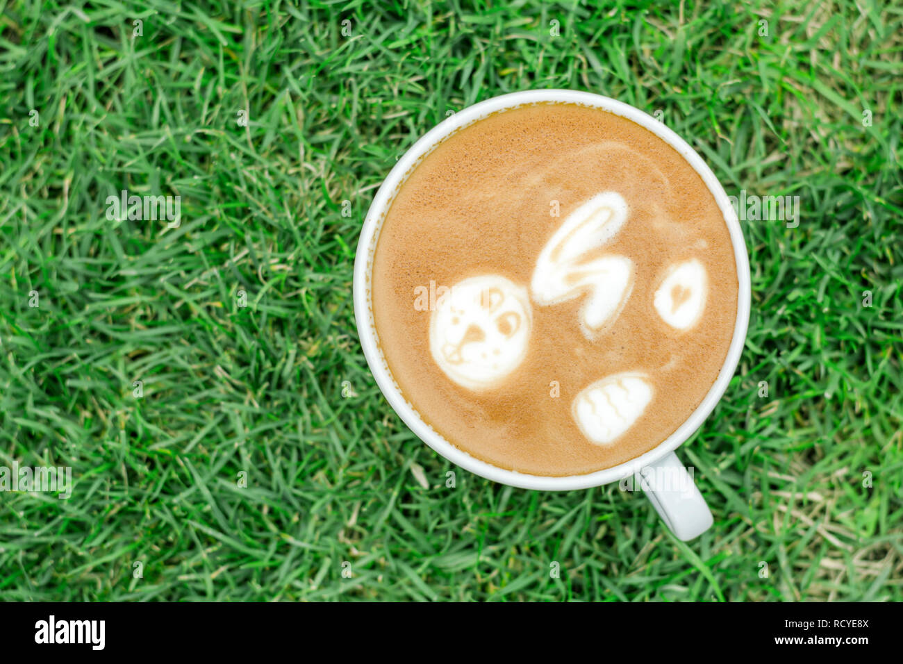 Cafe latte easter bunny latte art on green grass. Bunny easter Stock ...