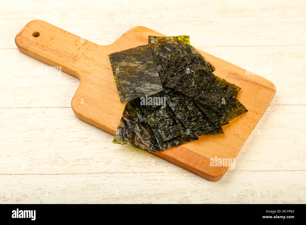 Crispy Nori sheets chips over wooden background Stock Photo - Alamy