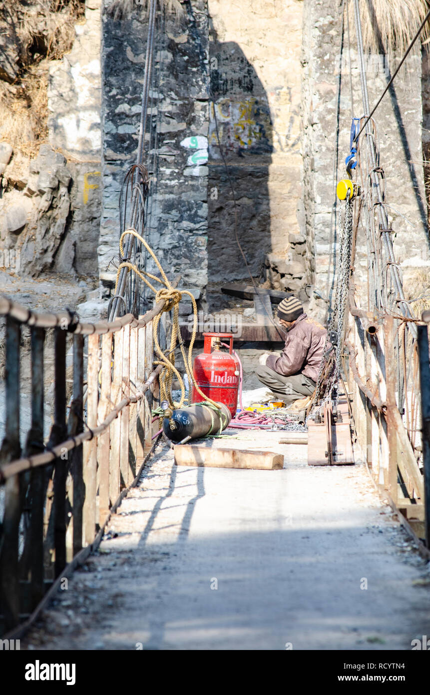 Repairing a footover bridge at Kasol. This joins the Chalal and Rashol ...
