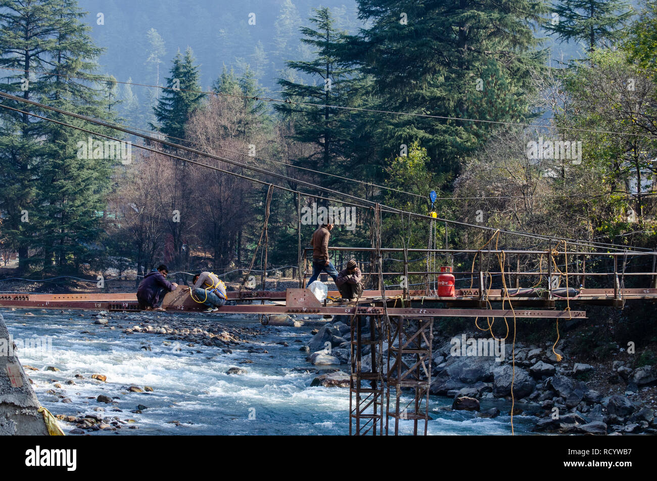 Repairing a footover bridge at Kasol. This joins the Chalal and Rashol ...