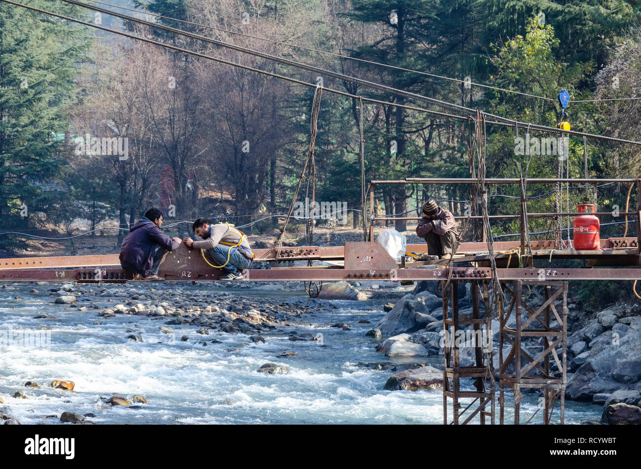 Repairing a footover bridge at Kasol. This joins the Chalal and Rashol ...