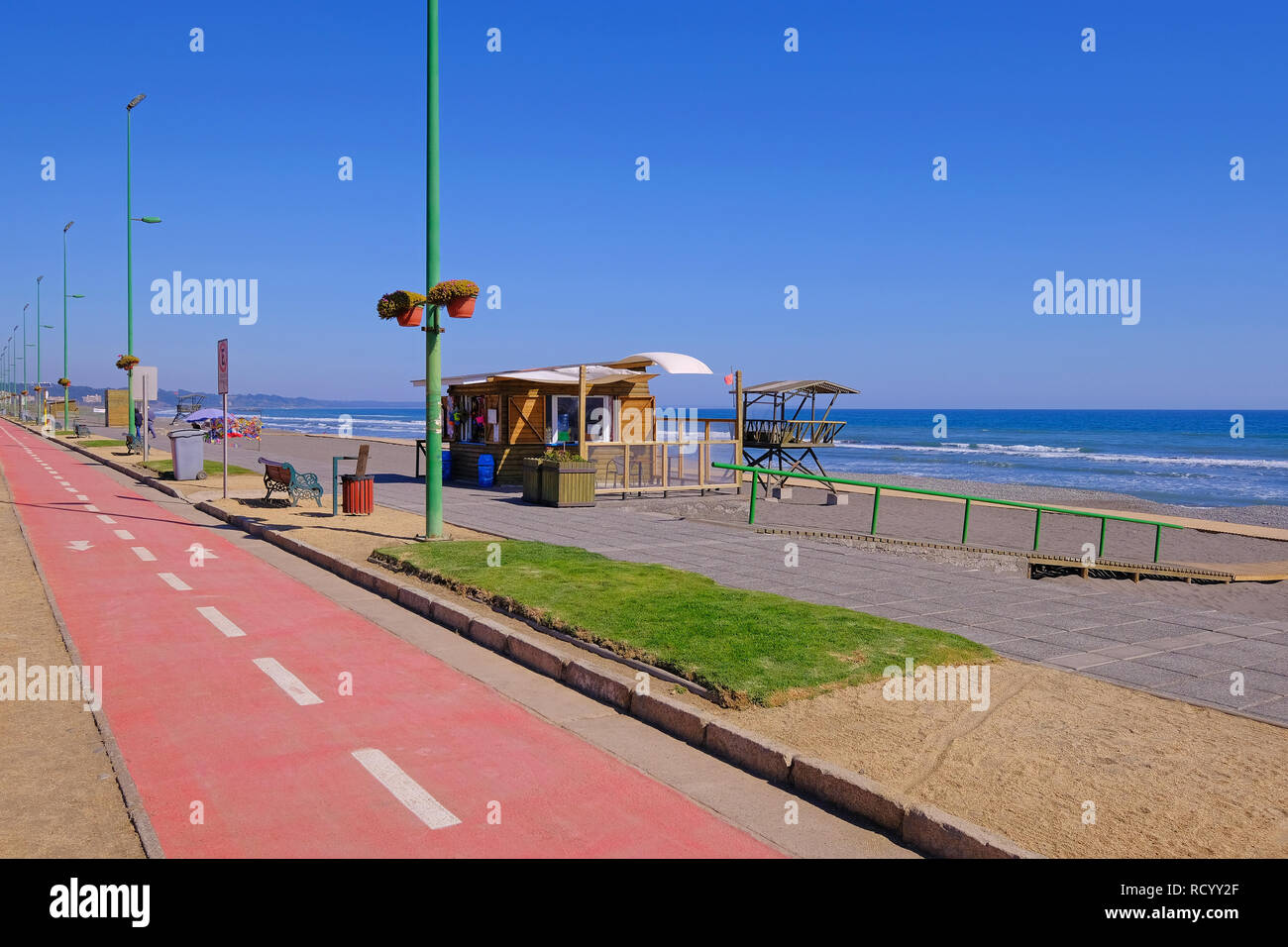 Coastal Pacific beach promenade with paved bike path and sandy beach ...