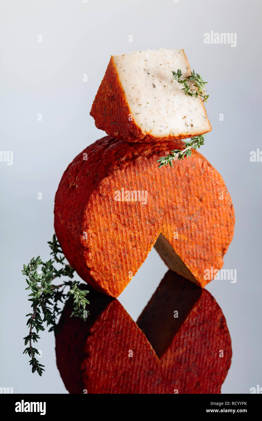 Red Pecorino sheep milk cheese with thyme and pepper. Traditional sheep ...
