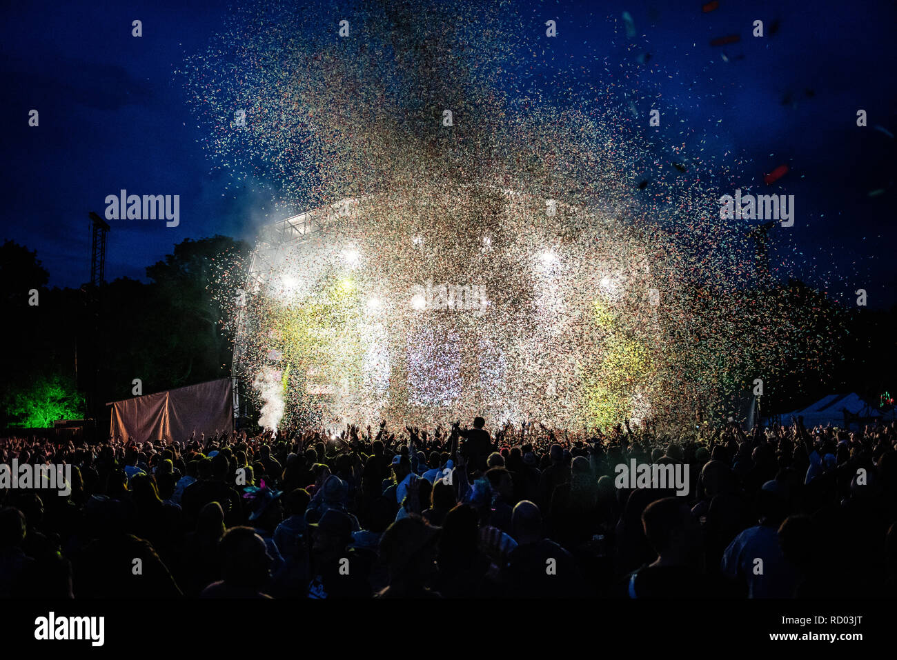 view of the stage and crowd at night with streamers Stock Photo - Alamy
