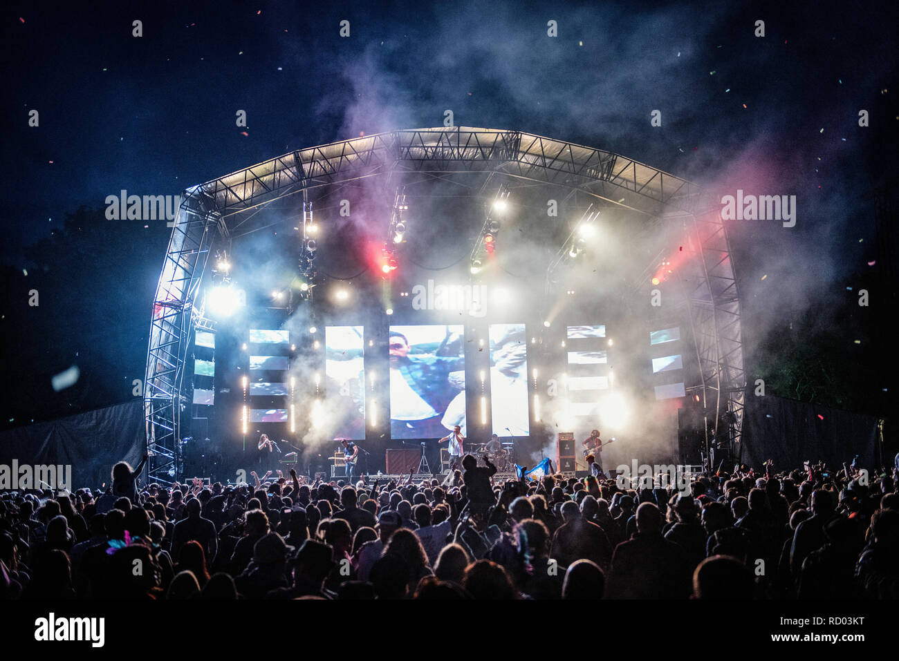 view of the stage and crowd at night with streamers Stock Photo - Alamy