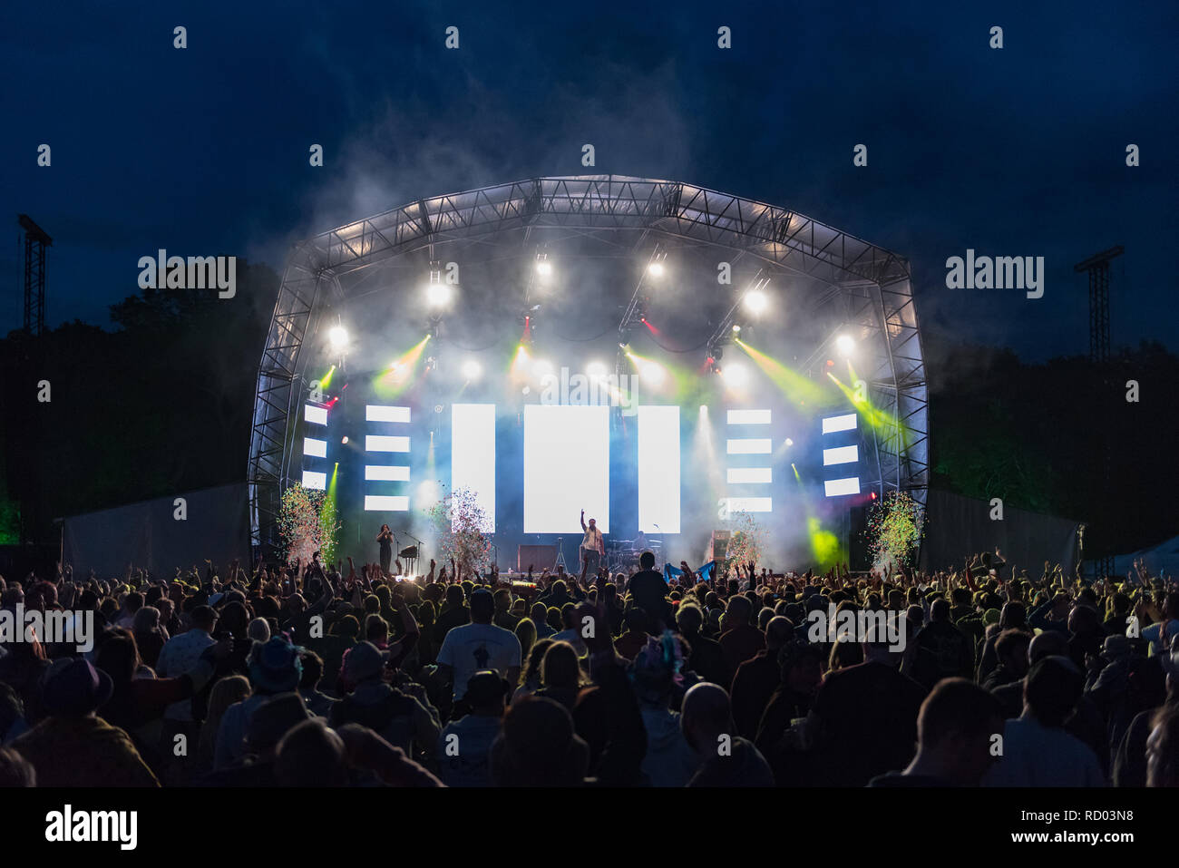 View of the stage and crowd at night with streamers Stock Photo - Alamy