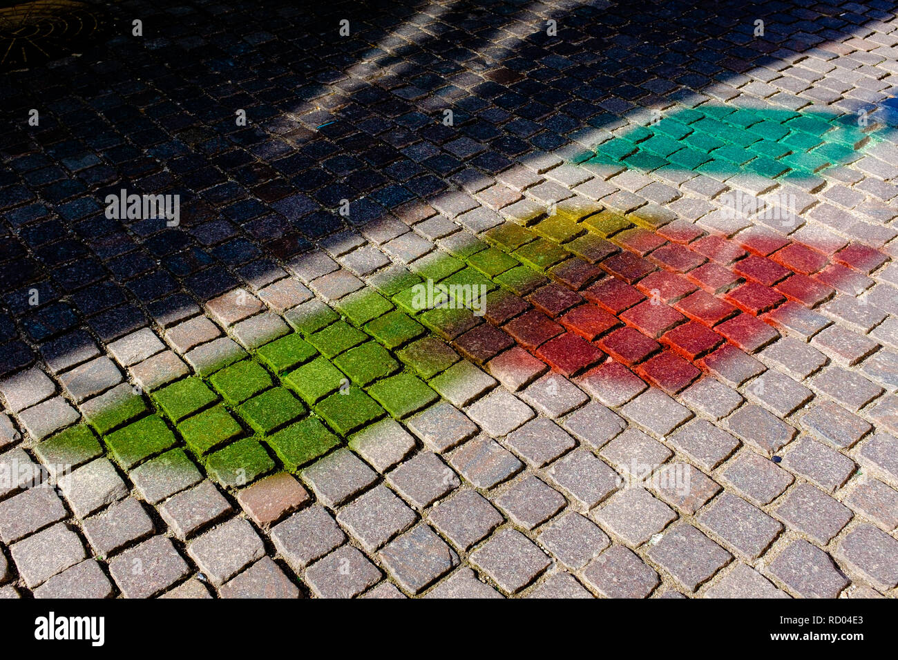 Coloured shapes on a cobbled street surface in Copenhagen Denmark Stock ...