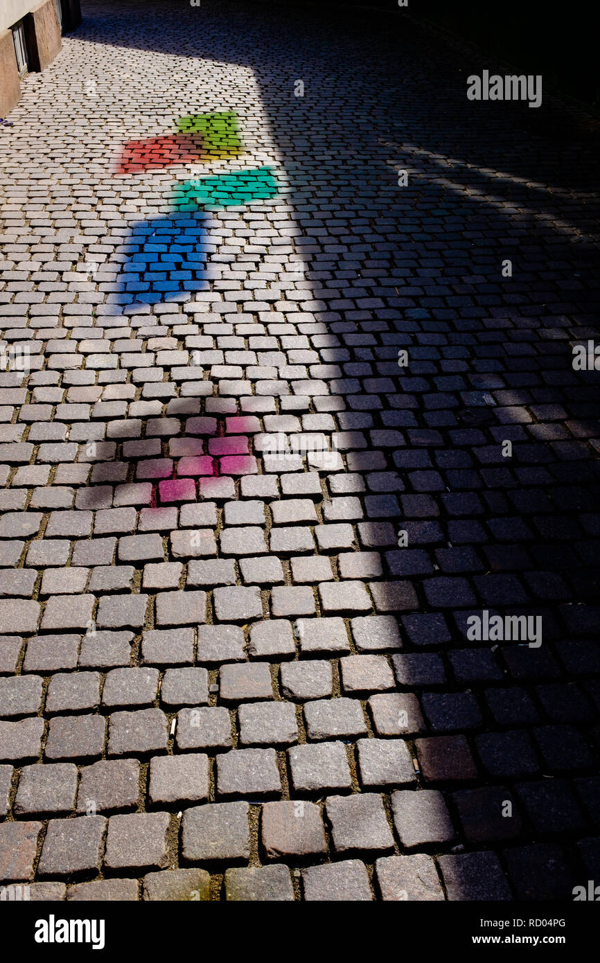 Coloured shapes on a cobbled street surface in Copenhagen Denmark Stock ...