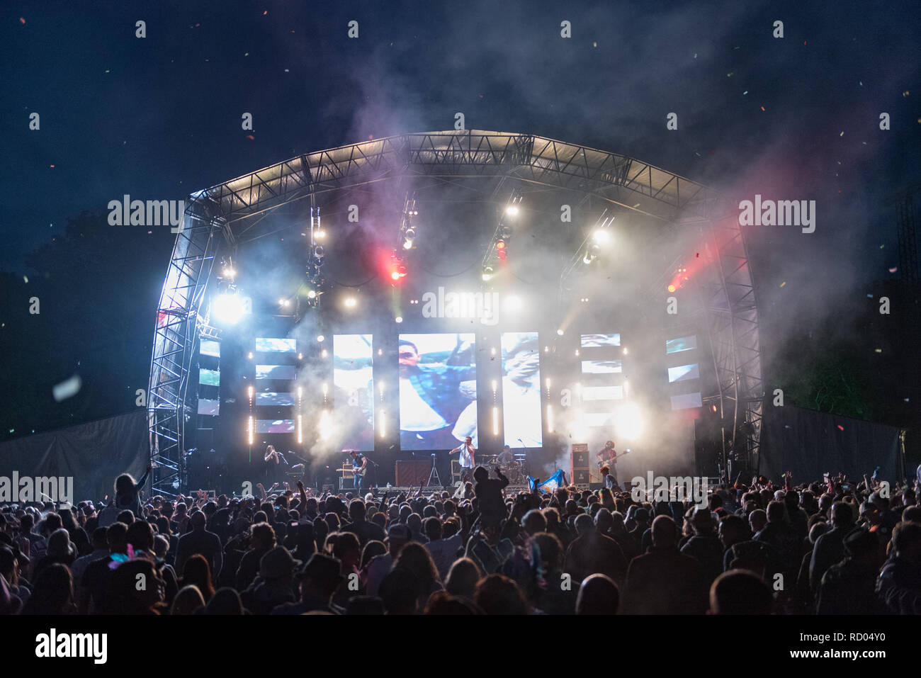 View of the stage and crowd at night with streamers Stock Photo - Alamy