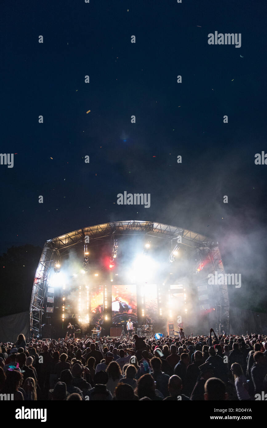 View of the stage and crowd at night with streamers Stock Photo - Alamy