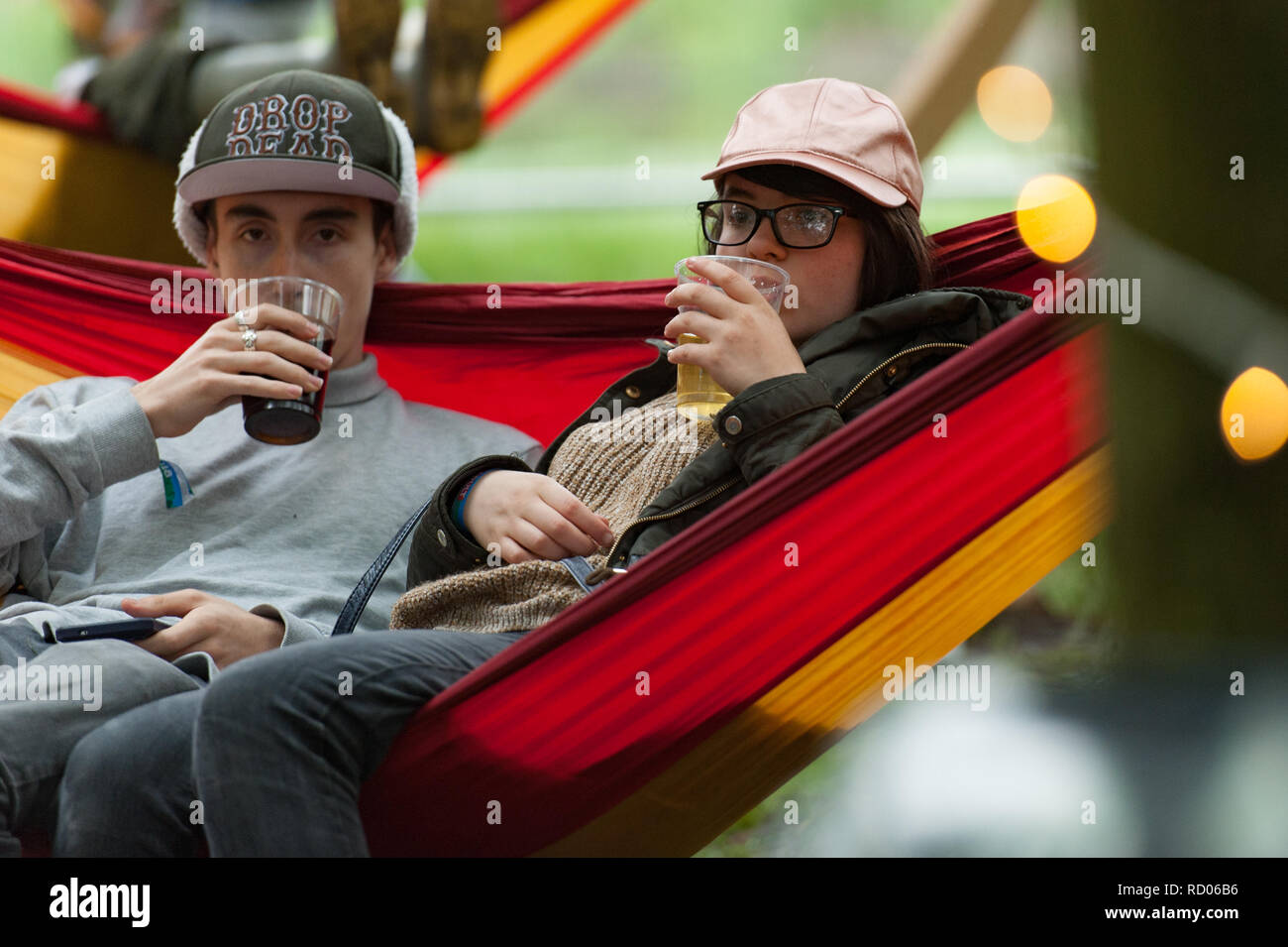 Two people chilling at a music festival Stock Photo - Alamy
