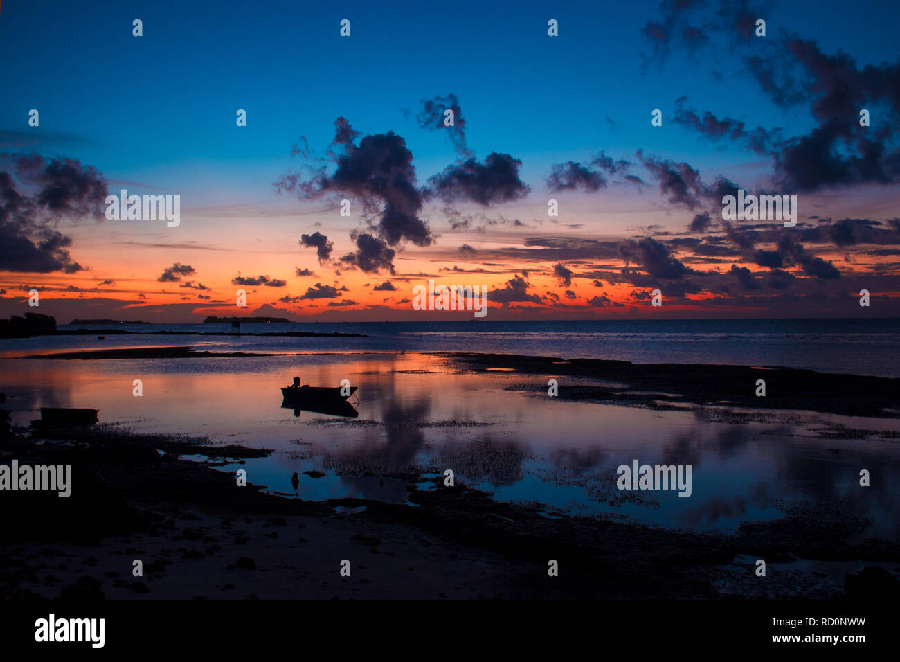 Sunset reflected on the water surface. Beautiful landscape with the ...