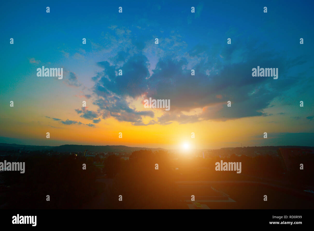Beautiful sunset sky above clouds with dramatic light Stock Photo - Alamy