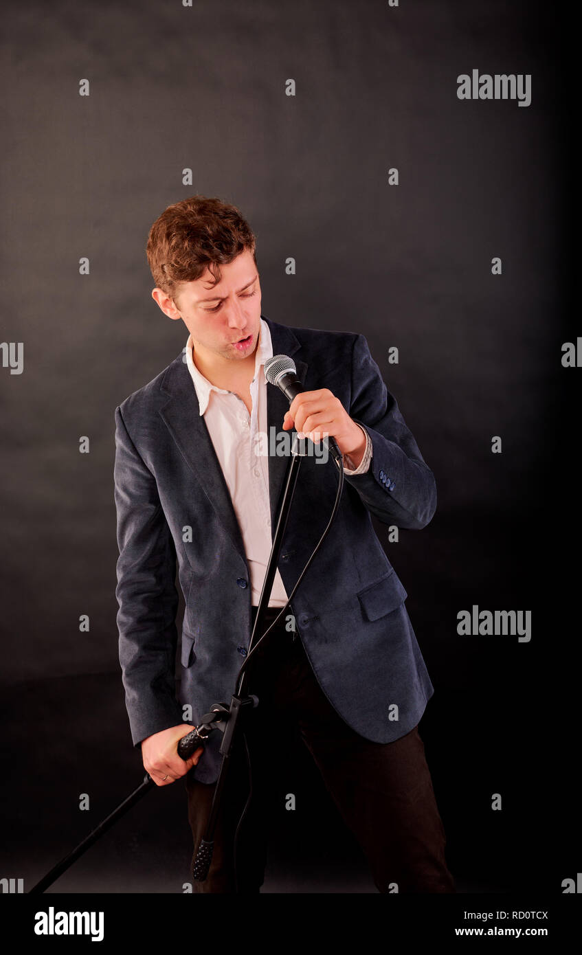 Boy in suit at microphone hi-res stock photography and images - Alamy