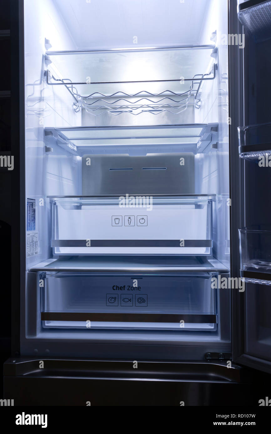 A completely bare fridge, open, light on, empty shelves Stock Photo - Alamy