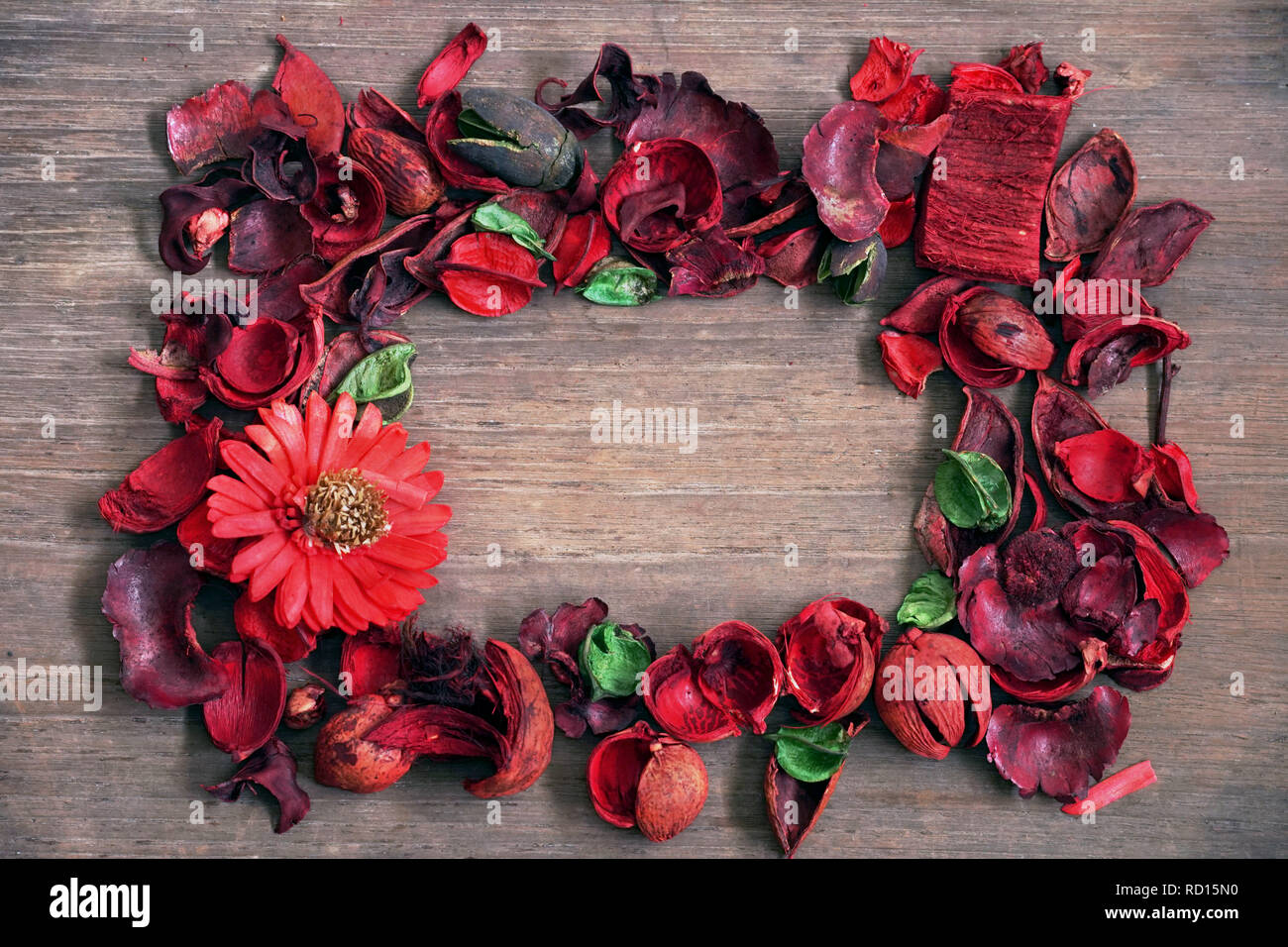 Dry red flower arrange to rectangle shape on wood background and have ...