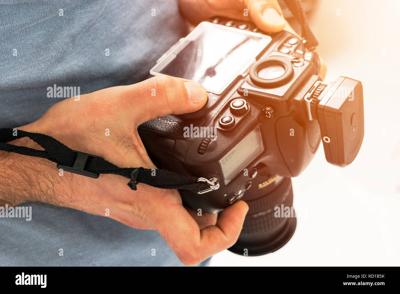 Digital single lens reflex camera in male hands. Photographer shooting ...