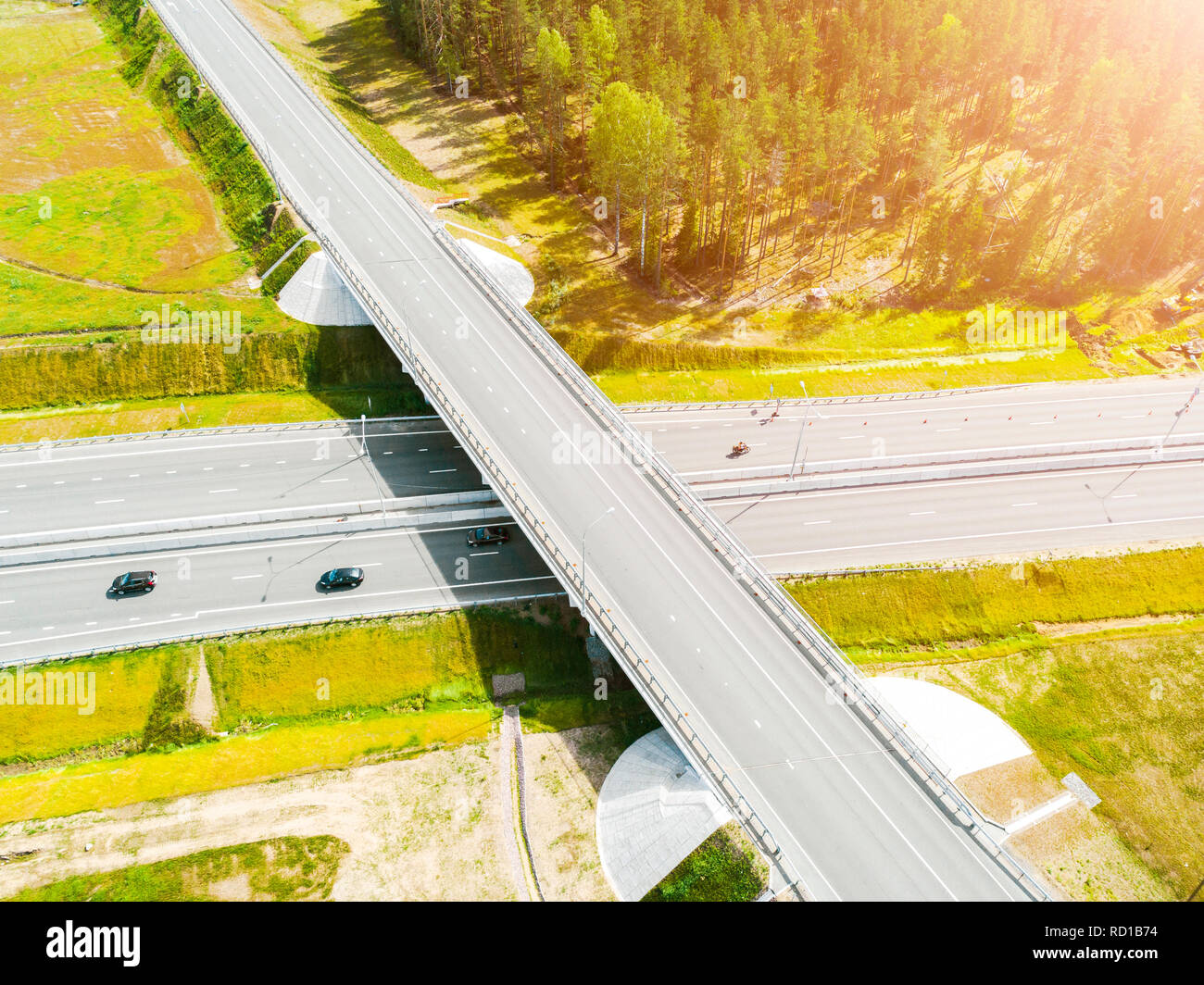 Aerial view of highway in city. Cars crossing interchange overpass ...