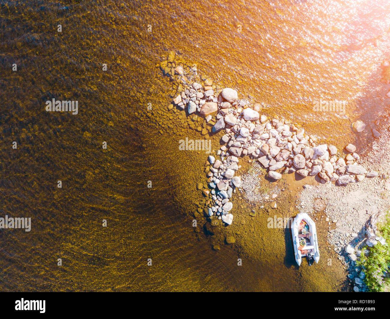 Aerial view of a fishing motor boat in the lake. Beautiful summer ...