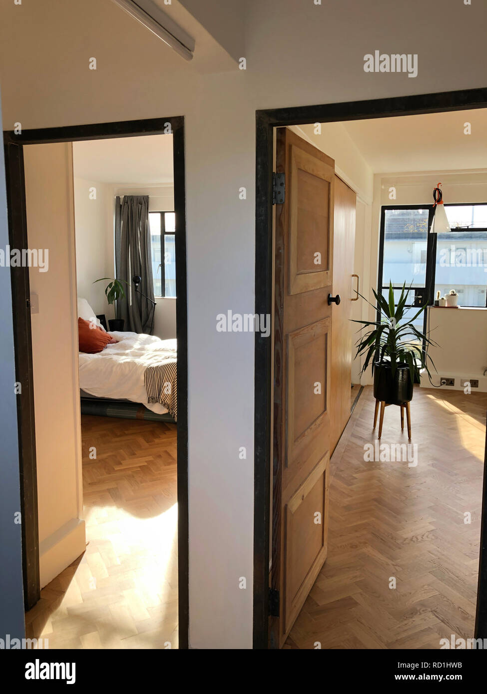 View into a lounge and bedroom in a modernist apartment, London, United ...