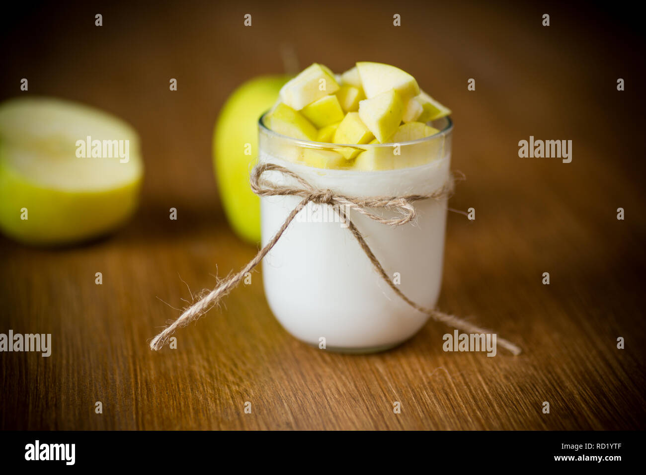 homemade yogurt with ripe apples on wooden table Stock Photo - Alamy
