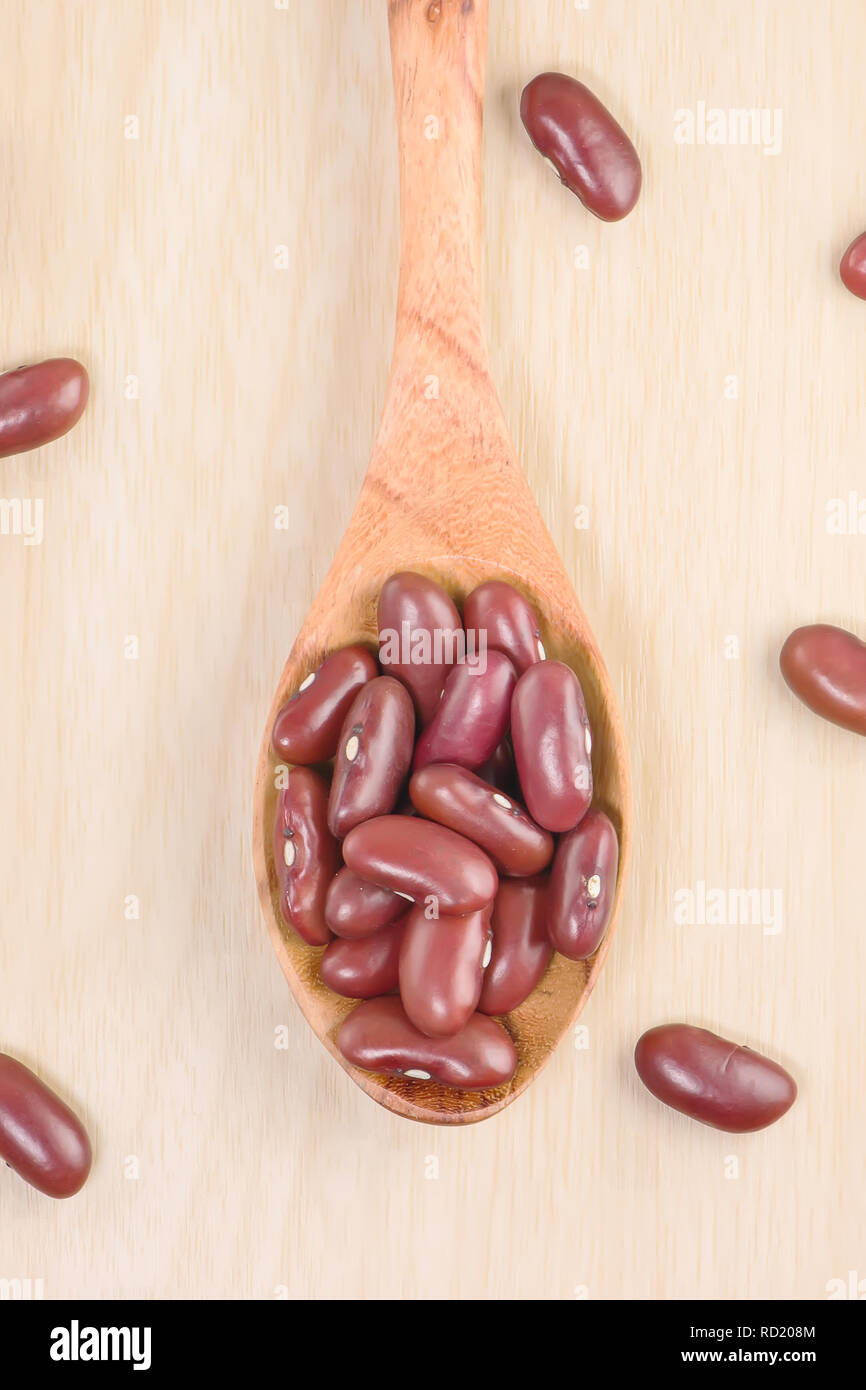 Red bean on the spoon on a wood background Stock Photo - Alamy