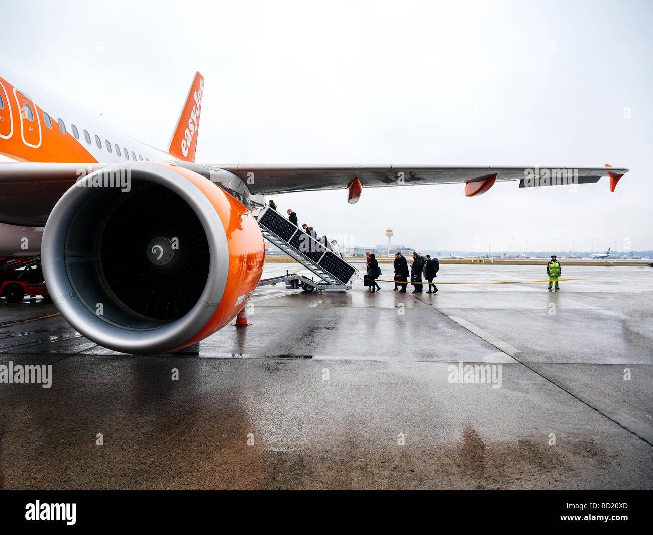 HAMBURG, GERMANY - MAR 22, 2018: People climbing stairs to EasyJet ...
