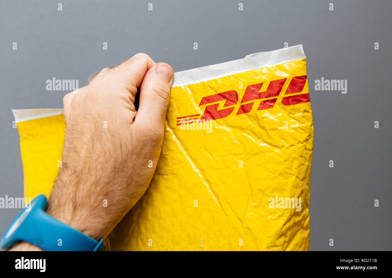PARIS, FRANCE - MAR 24, 2018: Male hand holding against gray background ...